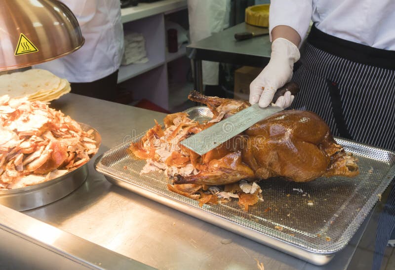 Chef Slicing Roasted Peking Duck Stock Image - Image of east, market ...