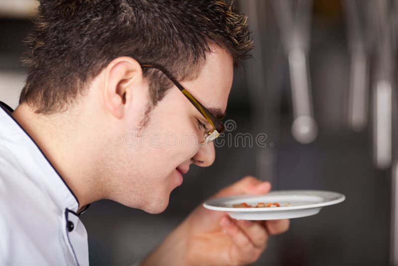 Chef Smelling Dish in Kitchen Stock Photo - Image of kitchen ...