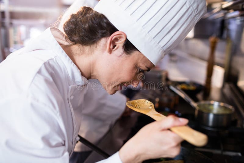 Chef Smelling Food in the Kitchen Stock Image - Image of professional ...