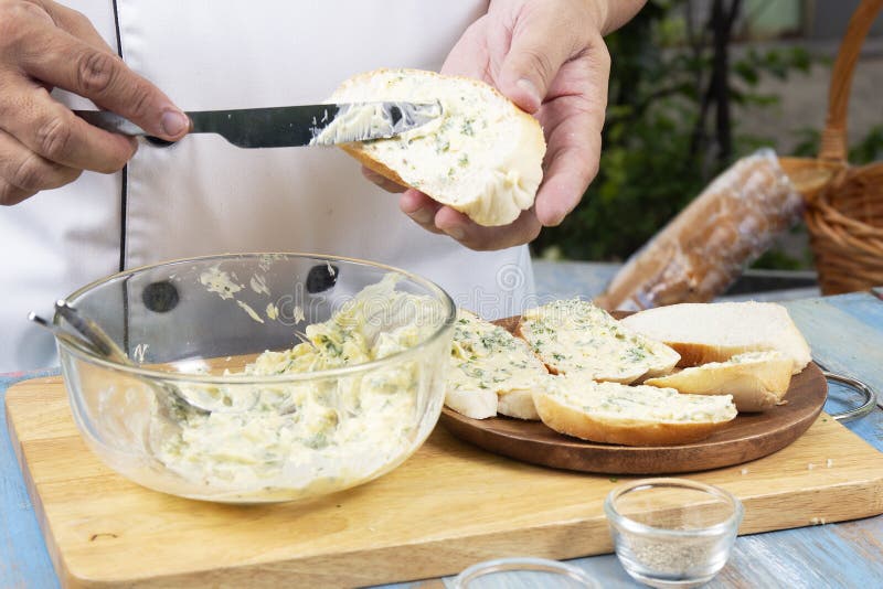 Chef Spread Garlic Butter on Slice Bread Stock Photo - Image of ...