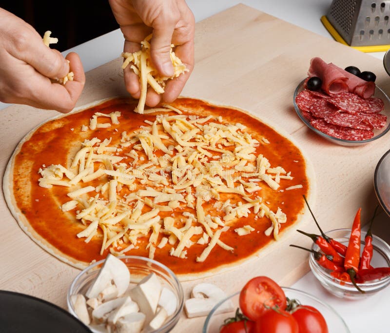Chef Spreading Cheese Toppings on Pizza Base Stock Photo - Image of ...
