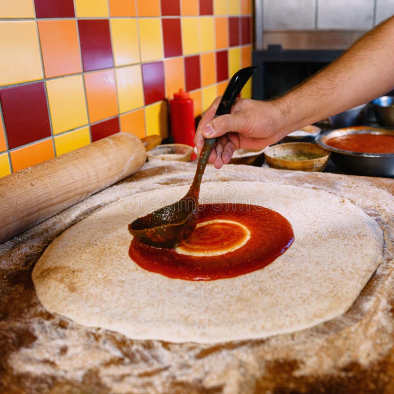 Chef Spreading Tomato Sauce on Pizza Dough Stock Image - Image of ...
