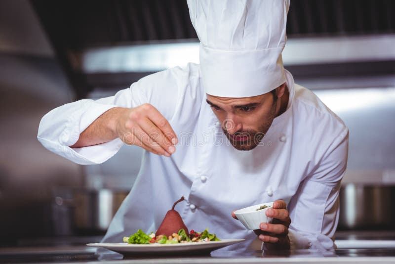Chef Sprinkling Spices on Dish Stock Photo - Image of cook, garnishing ...