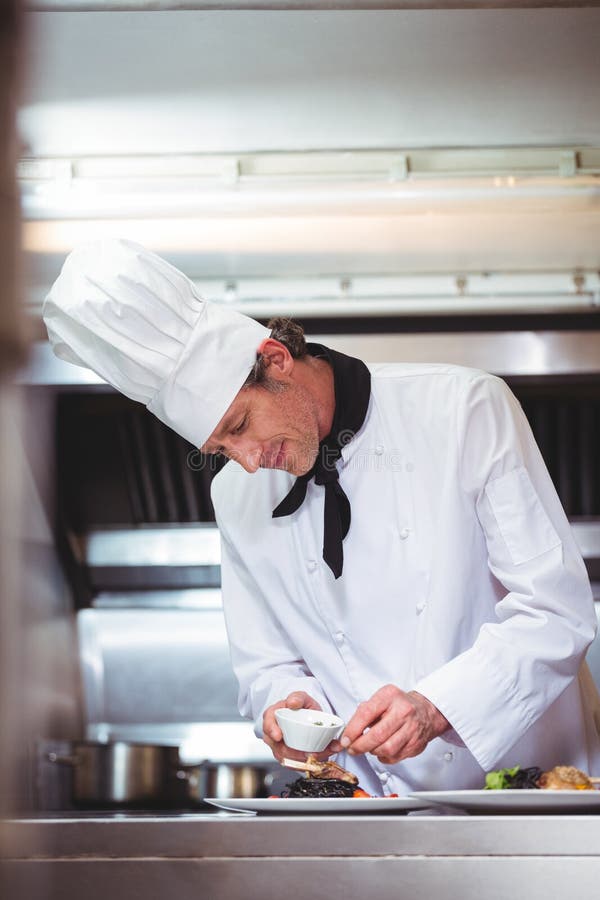 Chef Sprinkling Spices on Dish Stock Image - Image of male, culinary ...