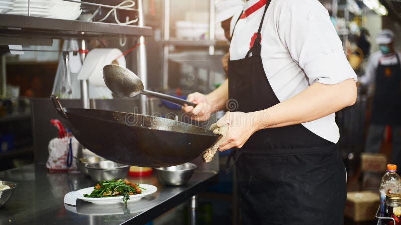 Chef stir fry busy cooking stock photo. Image of stainless - 189042696