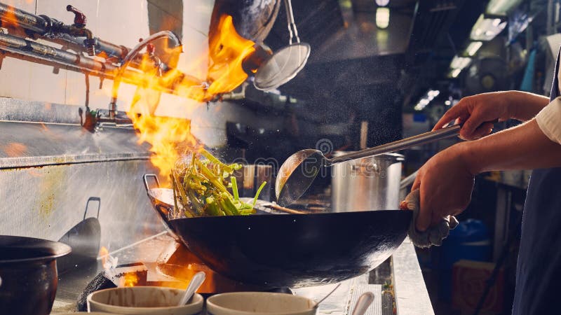Chef stir fry cooking stock photo. Image of professional - 190128732