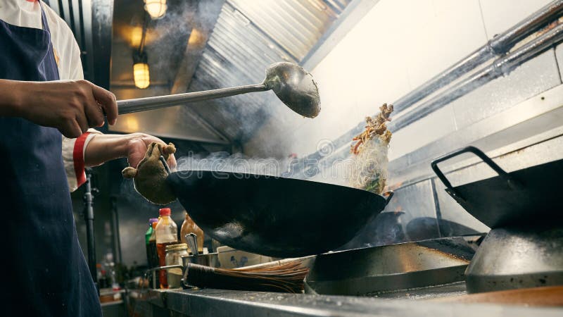 Chef stir fry cooking stock photo. Image of motion, occupation - 219390840