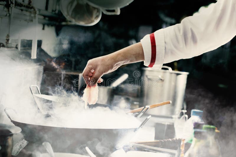 Chef stir fry in wok stock photo. Image of closeup, gourmet - 187768174