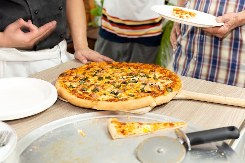 Chef Talking with Customer at Restaurant with Pizza on Table. Stock ...