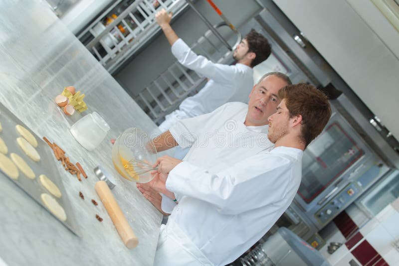 Chef Talking To Active Trainee Stock Image - Image of chef, people ...