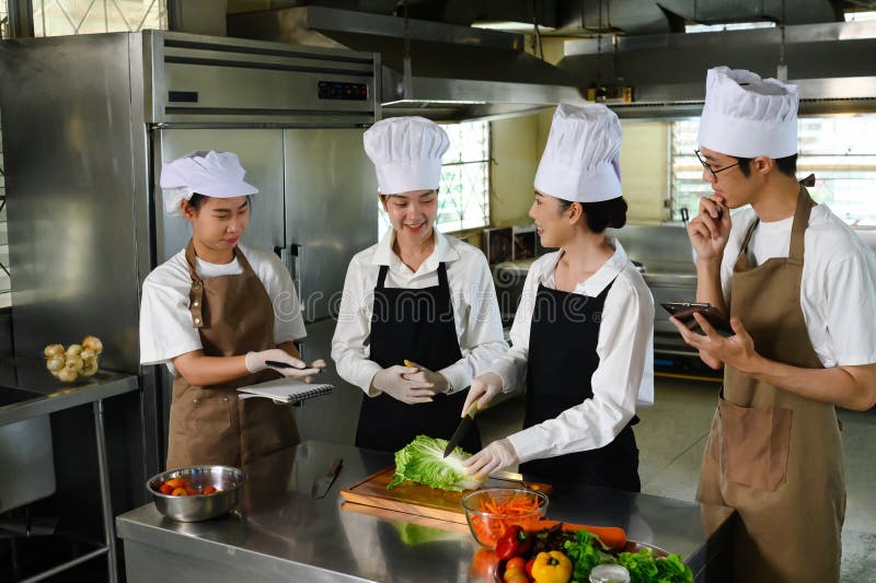 Chef Teacher Demonstrating Vegetable Preparation Technique in a ...