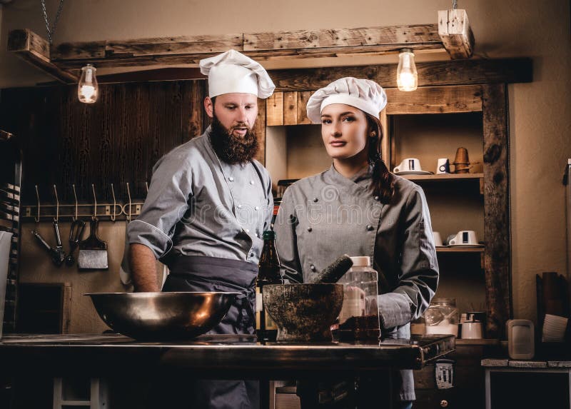 Chef Teaching His Assistant To Bake the Bread in the Bakery. Stock ...