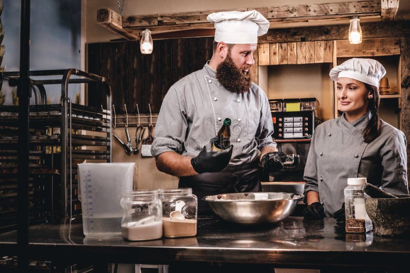 Chef Teaching His Assistant To Bake the Bread. Stock Photo - Image of ...