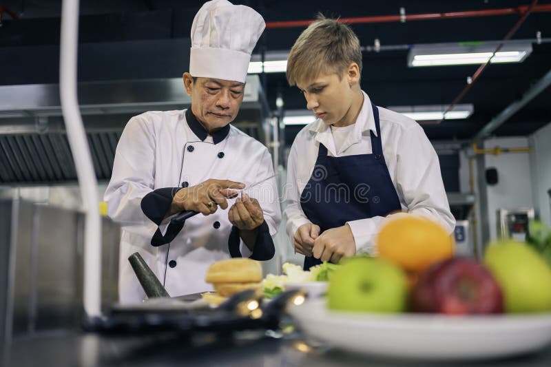 Chef Teaching Trainees How To Make Ice Cream. Cooking Tasty Ice Cream ...