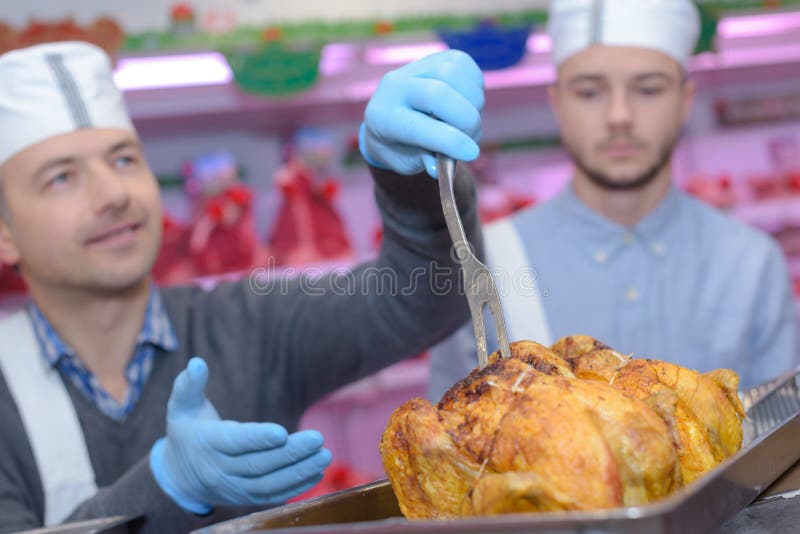 Chef Testing Chicken with Fork Stock Photo - Image of roasted, food ...