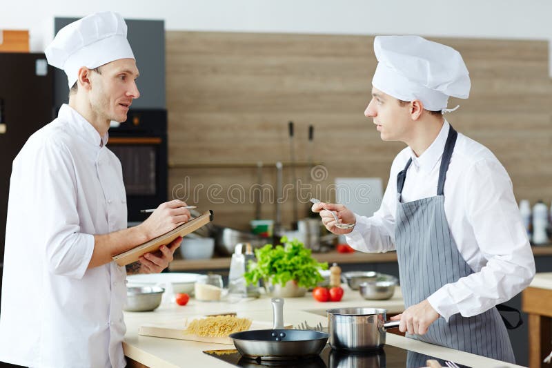 Chef Testing Intern Cook at Kitchen Stock Photo - Image of cooking ...
