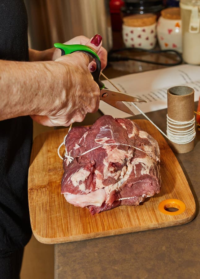 Chef Ties the Beef with Rope and Prepares it for Baking in the Oven ...