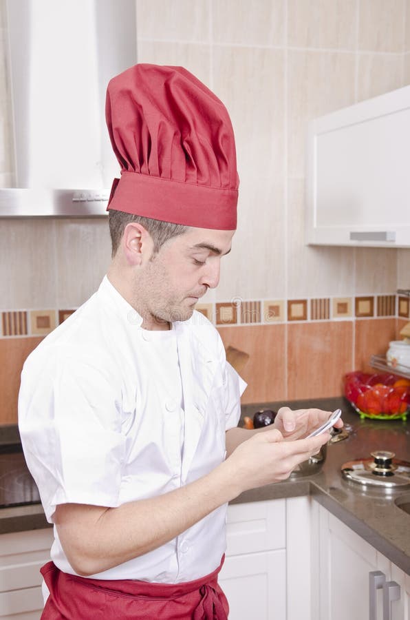 Chef Touching Smartphone in the Kitchen Stock Image - Image of ...