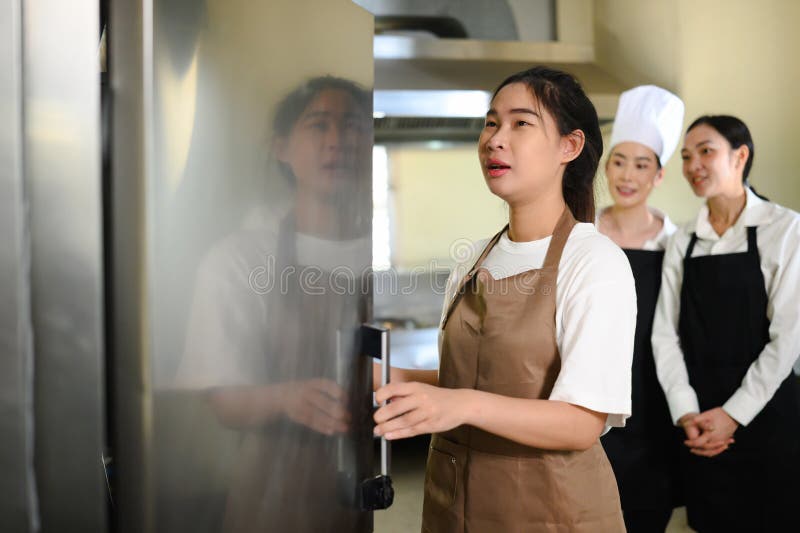 Chef Trainee Practicing Proper Food Handling and Storage during Cooking ...