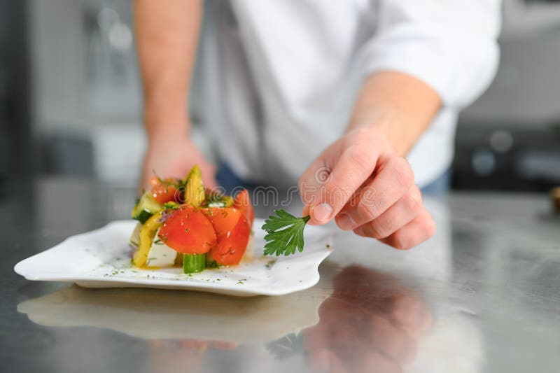 Chef in Uniform Cooking at the Restaurant Kitchen Stock Photo - Image ...
