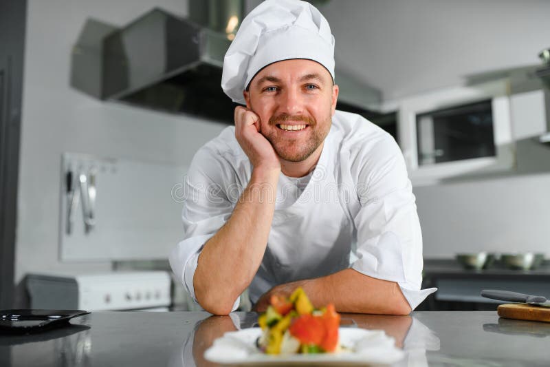 Chef in Uniform Cooking at the Restaurant Kitchen Stock Image - Image ...