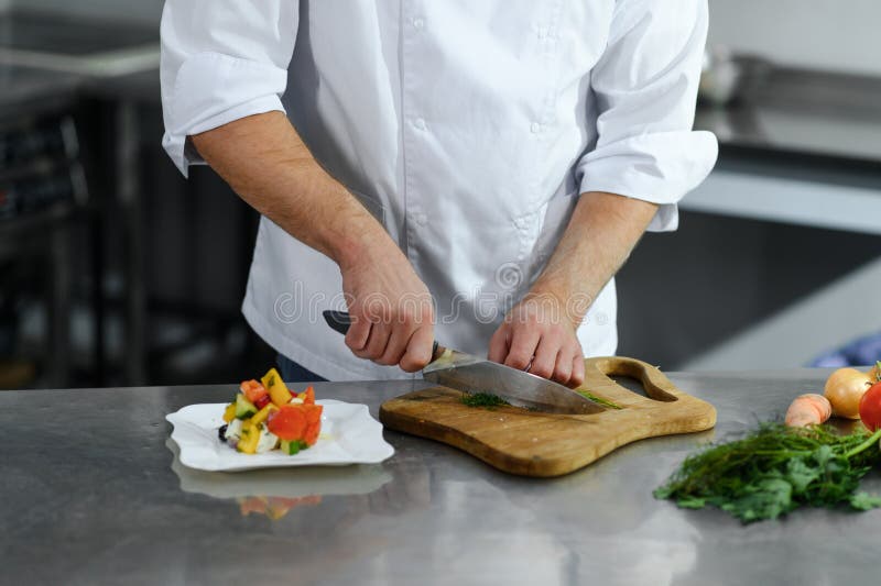 Chef in Uniform Cooking at the Restaurant Kitchen Stock Photo - Image ...