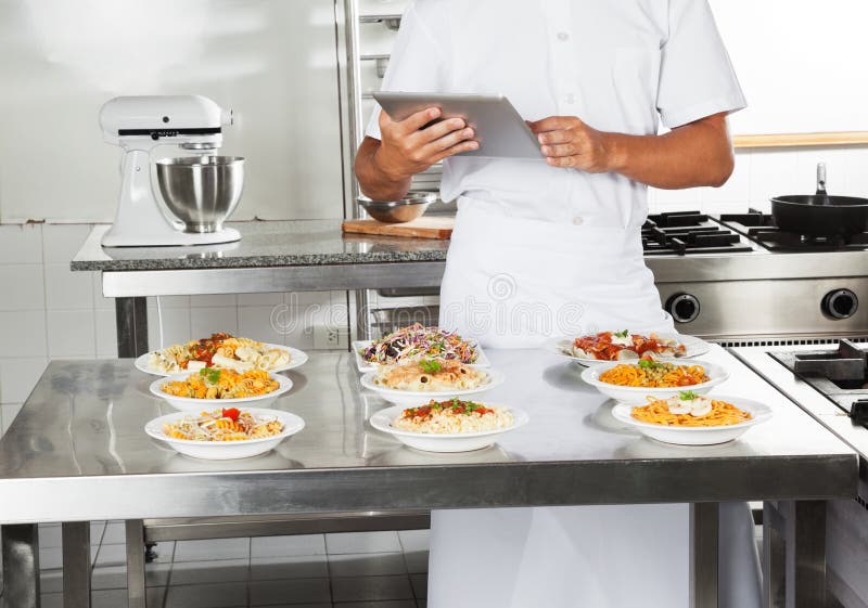 Chef Using Digital Computer in Kitchen Stock Image - Image of digital ...