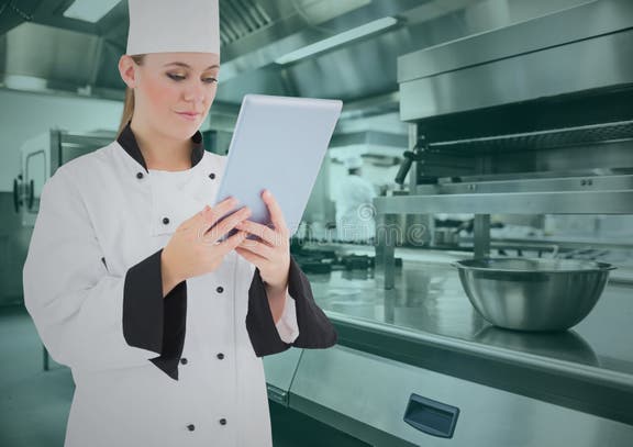 Chef Using Digital Tablet in Commercial Kitchen Stock Photo - Image of ...