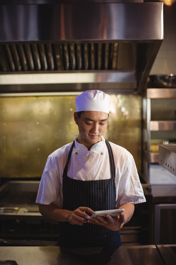 Chef Using Digital Tablet in the Commercial Kitchen Stock Image - Image ...