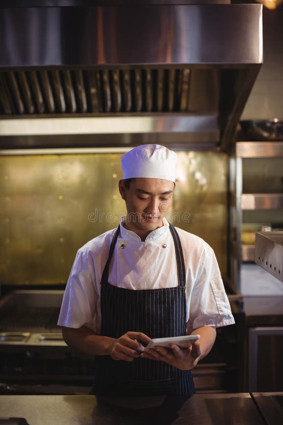 Chef Using Digital Tablet in the Commercial Kitchen Stock Image - Image ...
