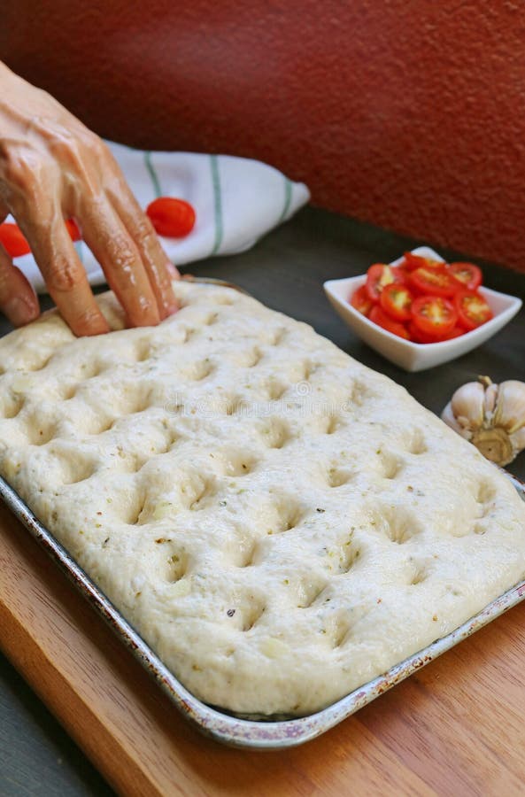 Chef Using Fingertips To Create Dimples in the Dough for Baking Italian ...