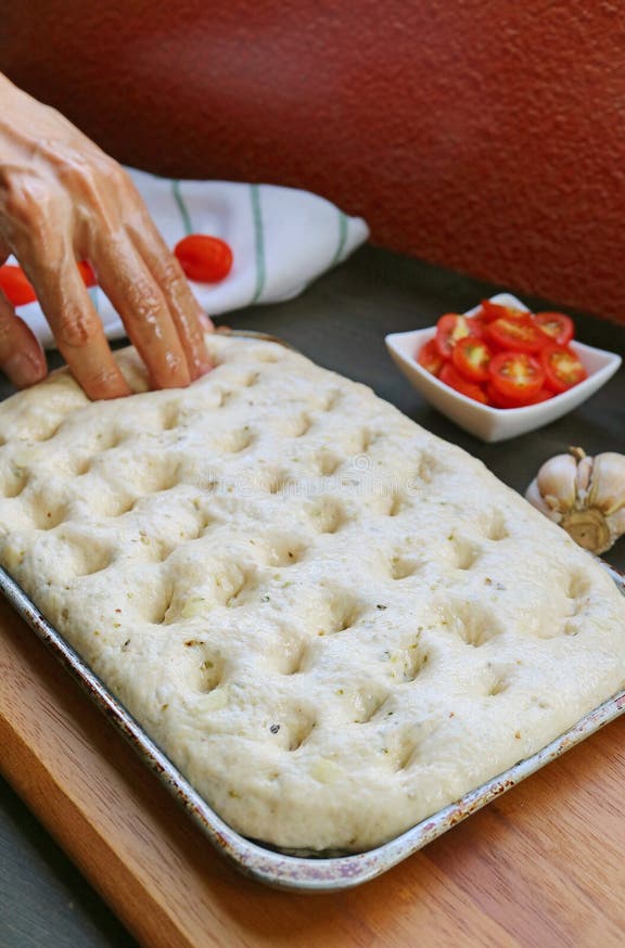 Chef Using Fingertips To Create Dimples in the Dough for Baking Italian ...