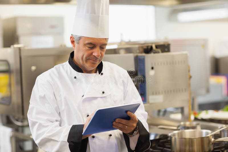 Chef Using His Digital Tablet Stock Photo - Image of food, scrolling ...