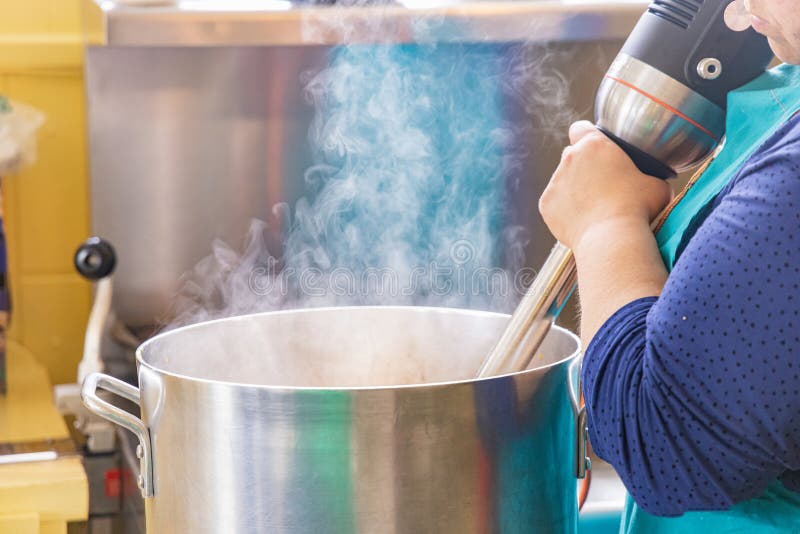 Chef Using Immersion Blender Preparing Food in Professional Kitchen ...