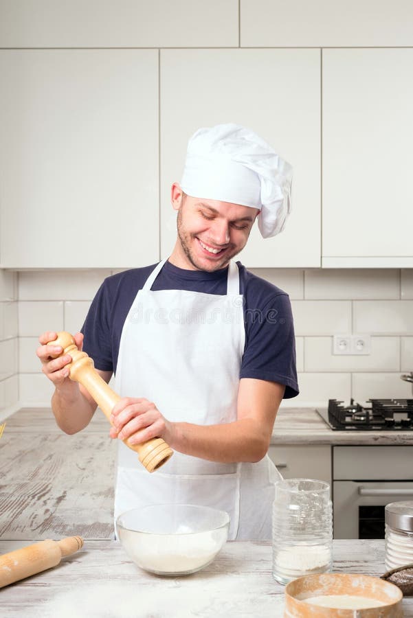 Chef Using Pepper Mill in Kitchen Stock Photo - Image of pepper ...