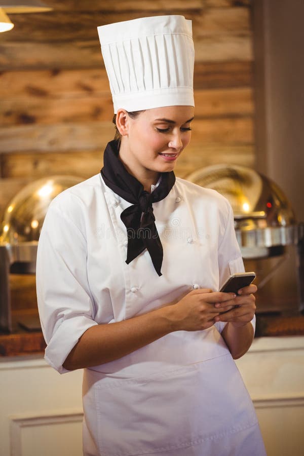 Chef using a smartphone stock photo. Image of retail - 73245938