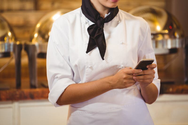 Chef using a smartphone stock image. Image of hotel, food - 73245949