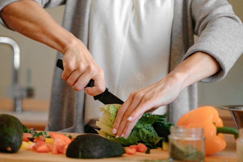 Chef Using a Steel Knife To Slice a Garbage and a Yellow Pepper in the ...
