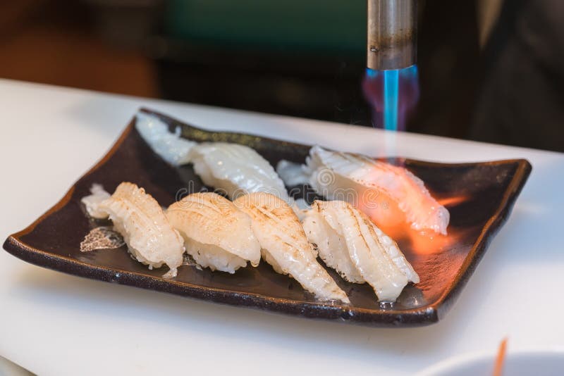 Chef Using a Torch Burn on Sushi in the Kitchen Stock Image - Image of ...