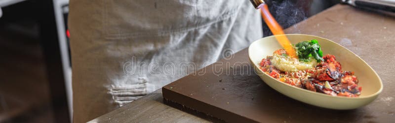 Chef Warm Up Dish with Fire in Restaurant Kitchen before Serving for ...