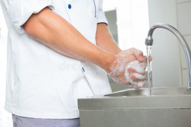 Chef Washing Hands Prior To Cook Stock Photo - Image of male, tiles ...