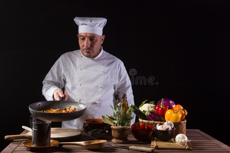Chef in White Uniform and Hat with the Cooking Pan Stock Image - Image ...
