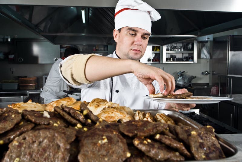 Two chefs at work stock photo. Image of gourmet, chef - 6401604