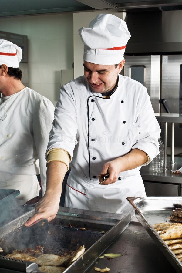 Two chefs at work stock photo. Image of gourmet, chef - 6401604