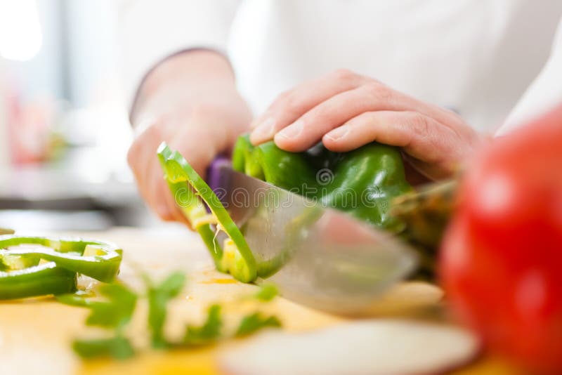 Chef Cutting Vegetables in His Restaurant Kitchen Stock Image - Image ...