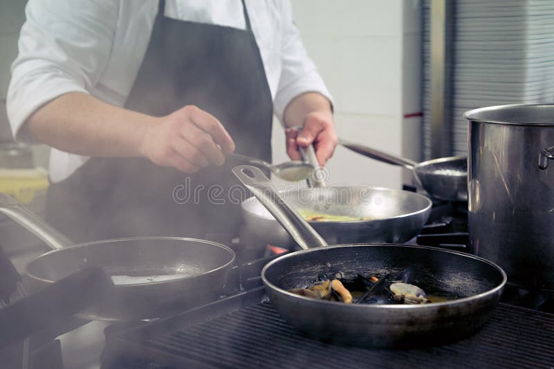 Chef at Work on Restaurant Kitchen Stock Image - Image of fresh, mussel ...
