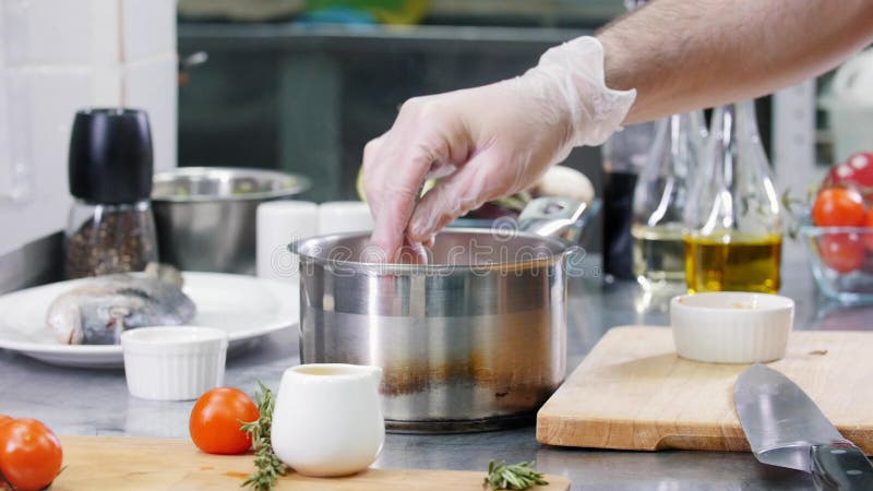 A Chef Working in the Kitchen. Mixing the Soup Ingredients Stock Photo ...