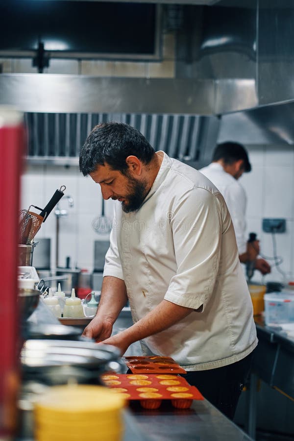 Chef Working in a Professional Kitchen, Haute Cusine Stock Photo ...