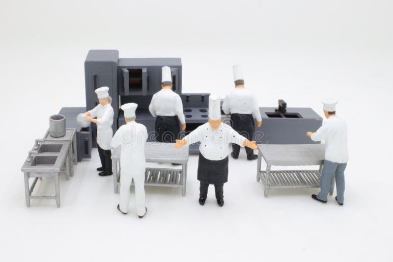 A Chef Works in a Big Restaurant Kitchen with His Help Stock Photo ...