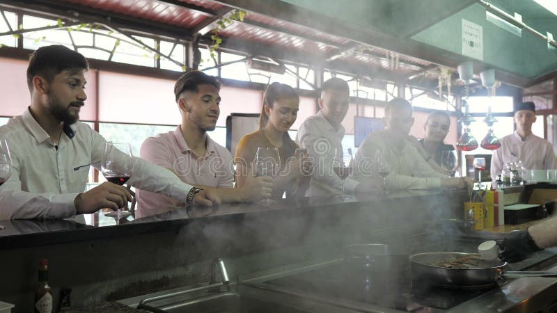 Chefs Cook in White Uniform for Clients on the Bar Table at the Open ...